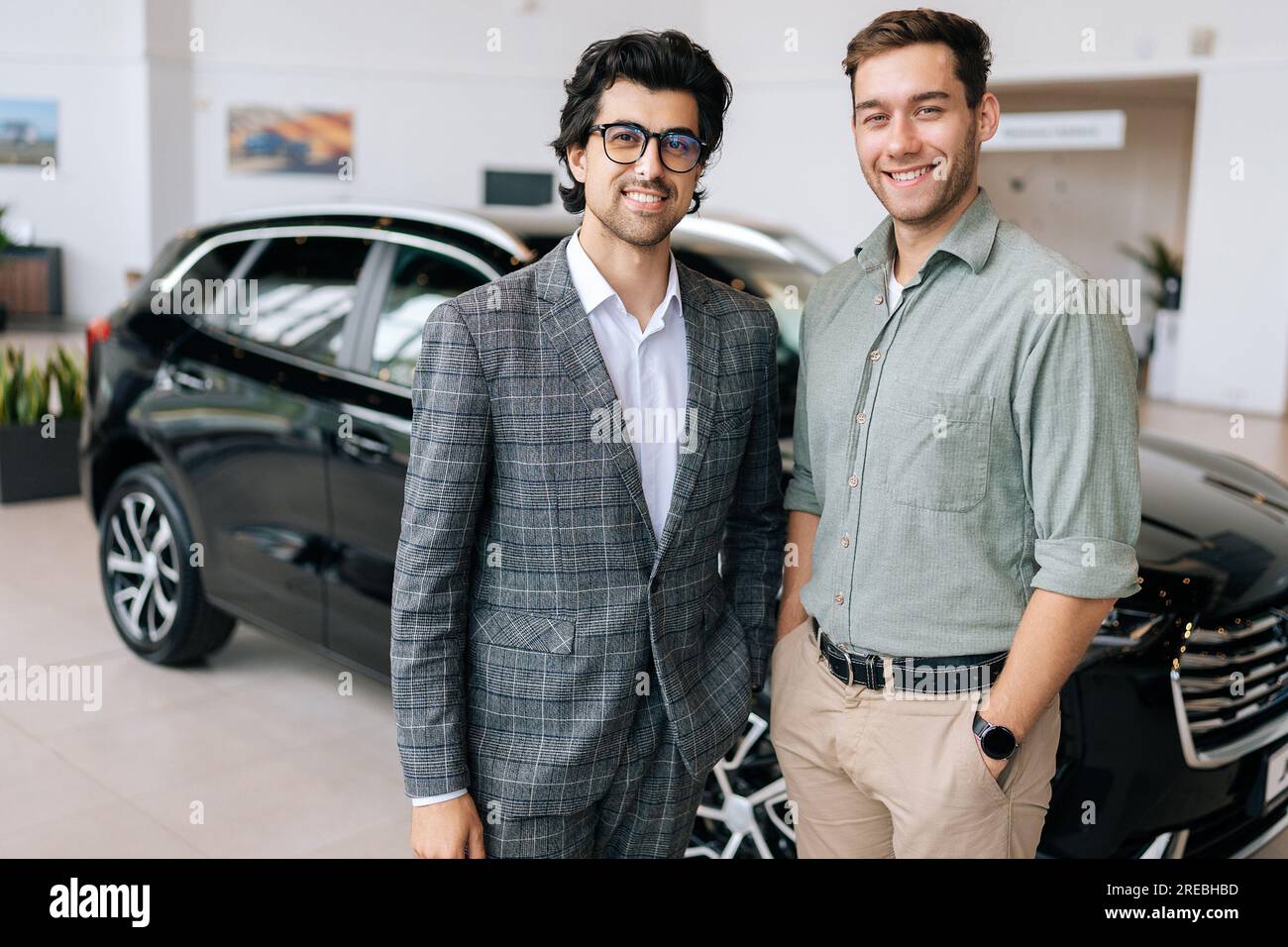 Medium shot portrait of cheerful bearded client male and professional ...
