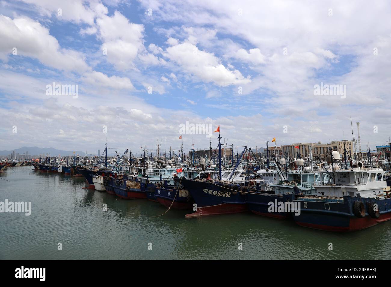 Aerial photo shows fishing vessels anchoring at a harbor to avoid ...