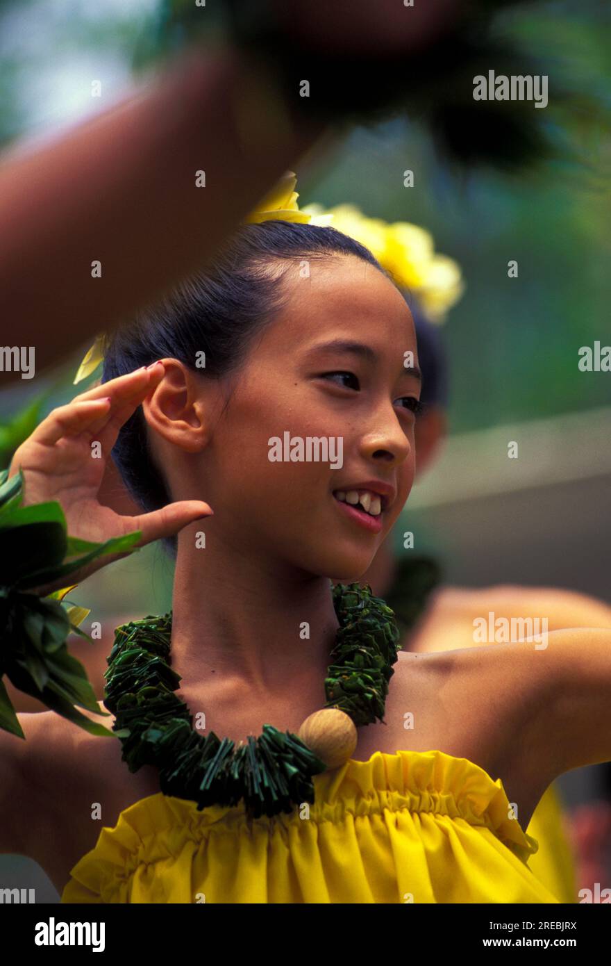 Young girl dancing hula at an outdoor setting Stock Photo - Alamy