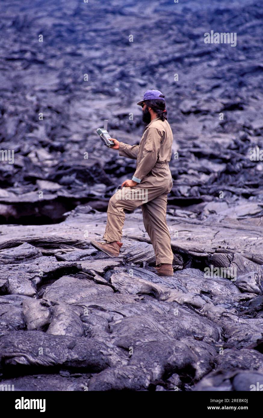 Volcanologist measuring lava flow from Kilauea, the worlds most active ...
