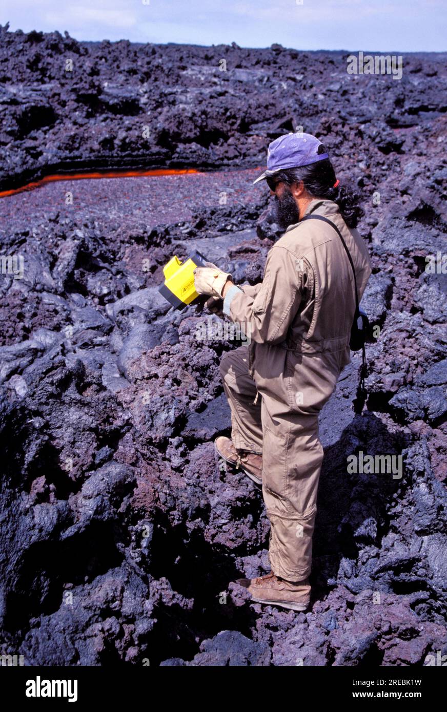 Volcanologist measuring lava flow from Kilauea, the worlds most active ...