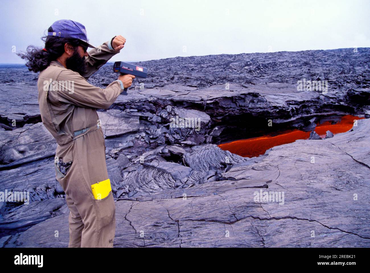 Volcanologist measuring lava flow from Kilauea, the worlds most active ...