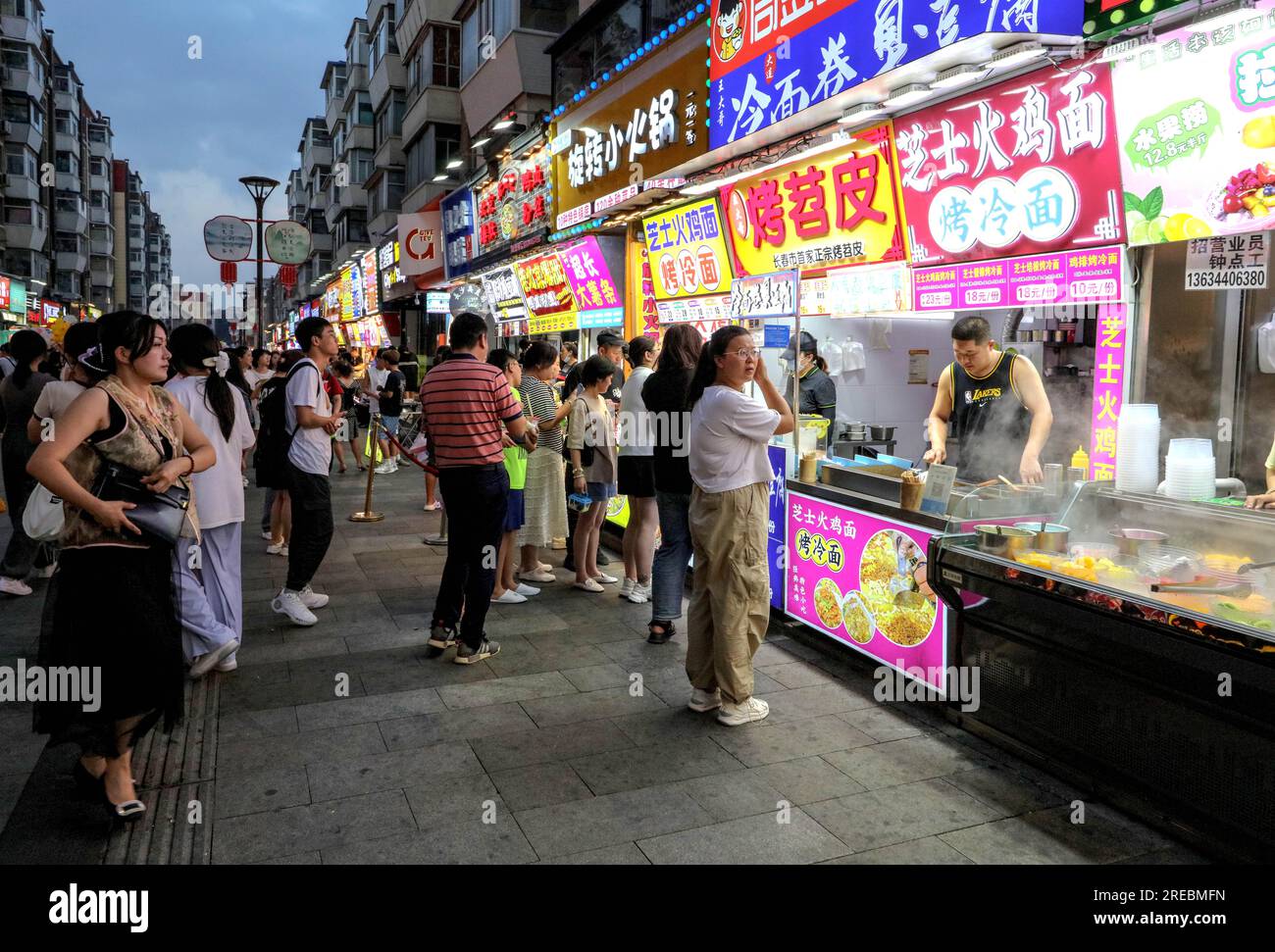 Visit the night market on a food street in Changchun City, northeast ...