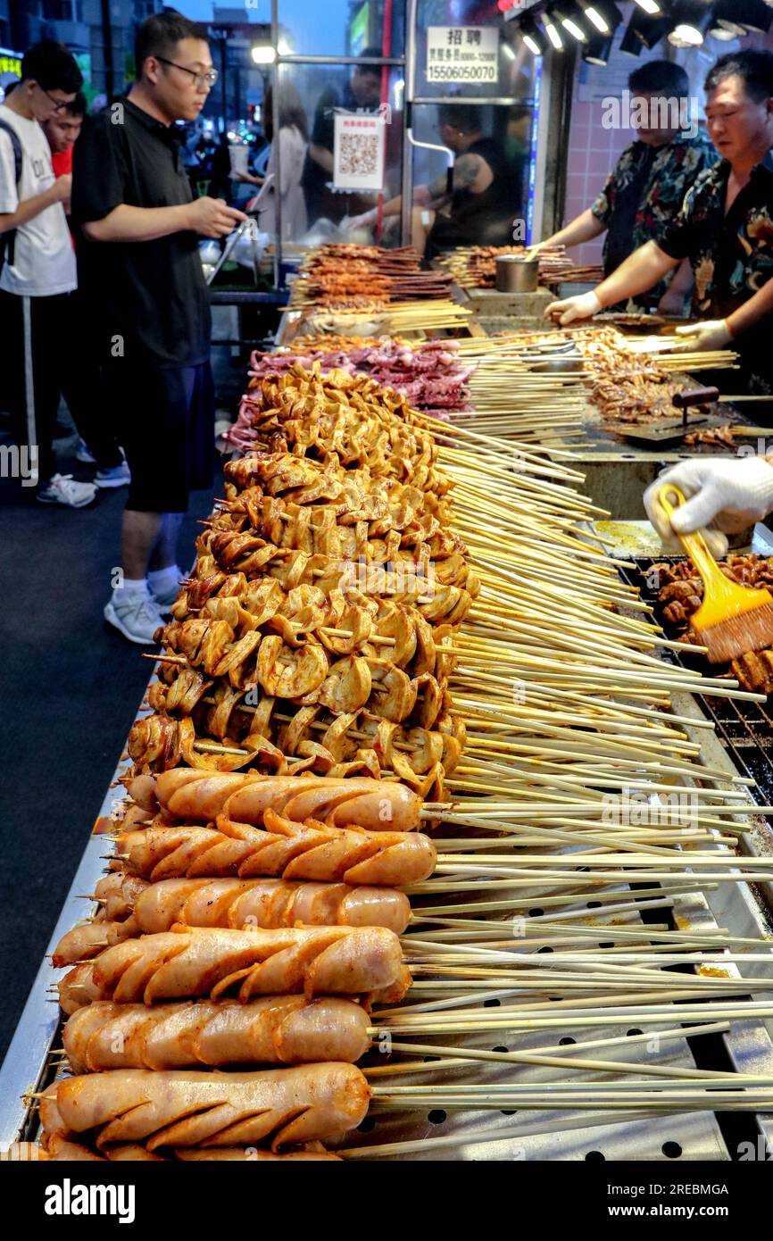 Visit the night market on a food street in Changchun City, northeast ...