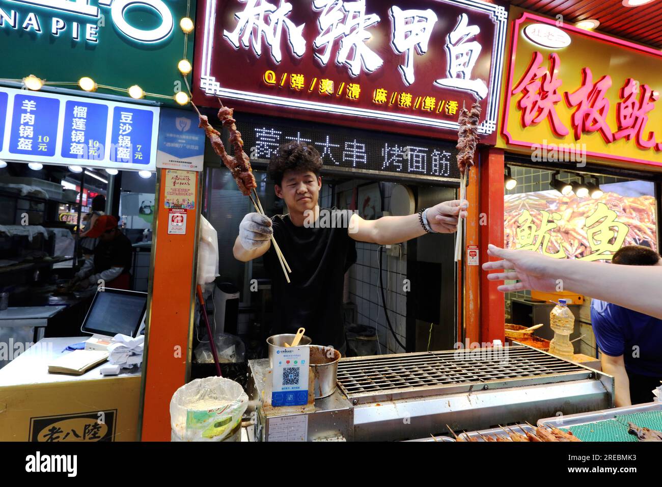 Visit the night market on a food street in Changchun City, northeast ...
