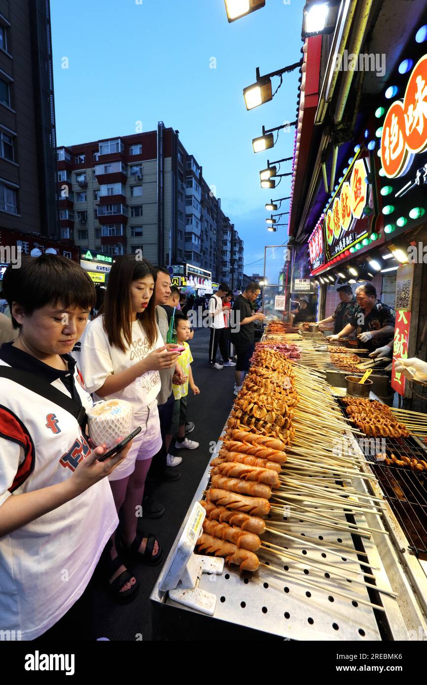 Visit the night market on a food street in Changchun City, northeast ...