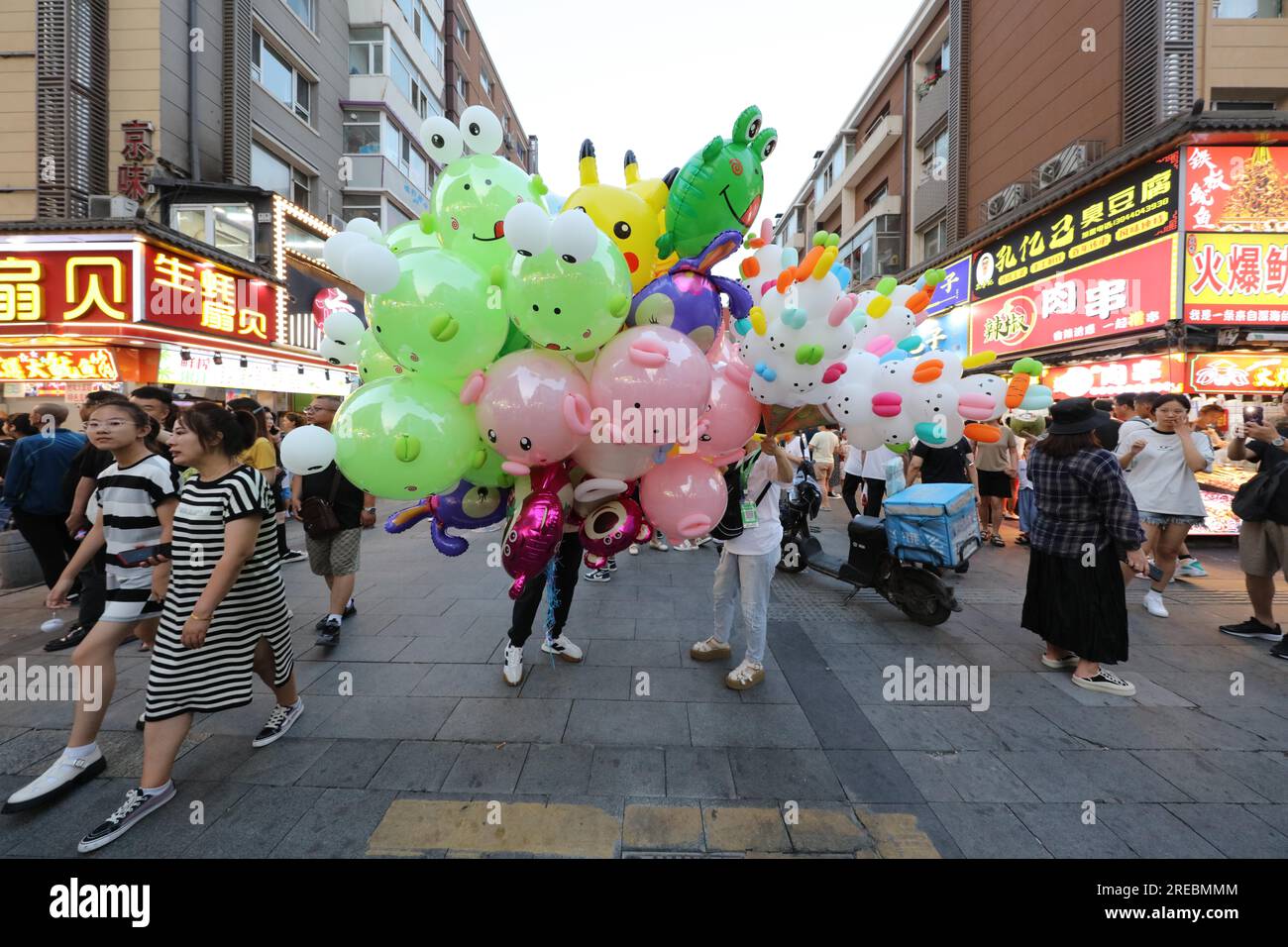 Visit the night market on a food street in Changchun City, northeast ...