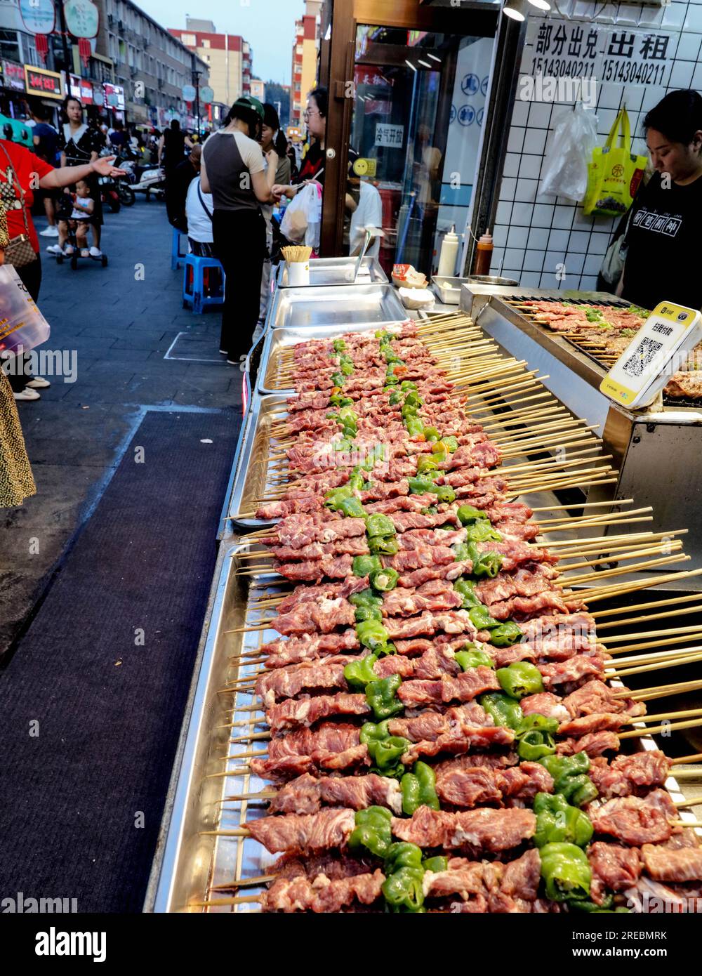 Visit the night market on a food street in Changchun City, northeast ...