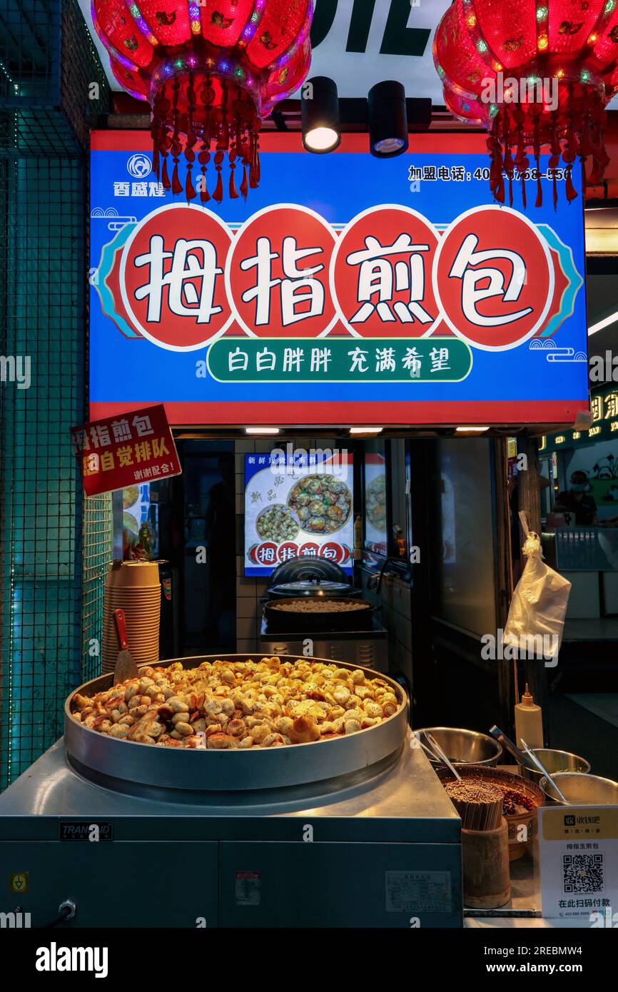 Visit the night market on a food street in Changchun City, northeast ...