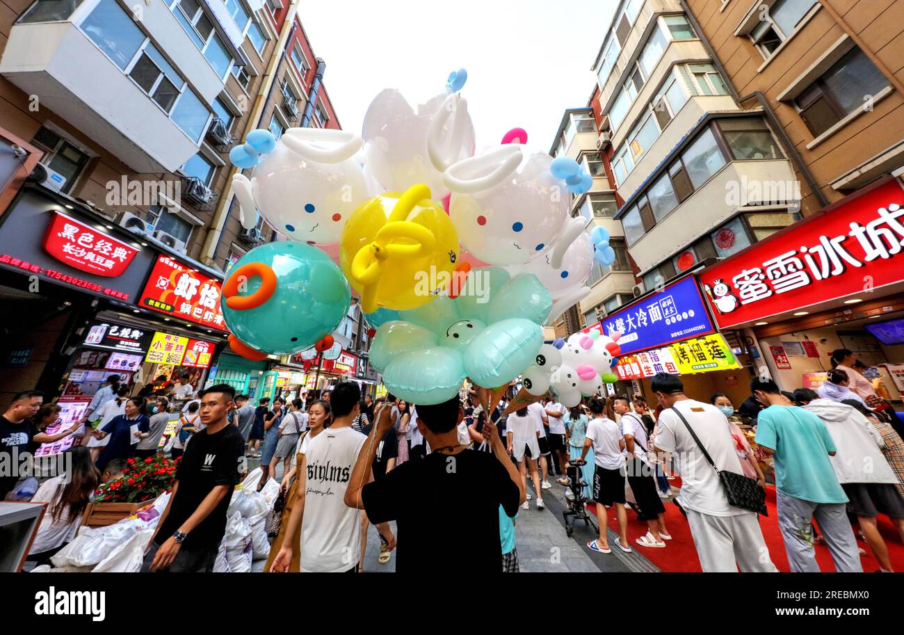 Visit the night market on a food street in Changchun City, northeast ...