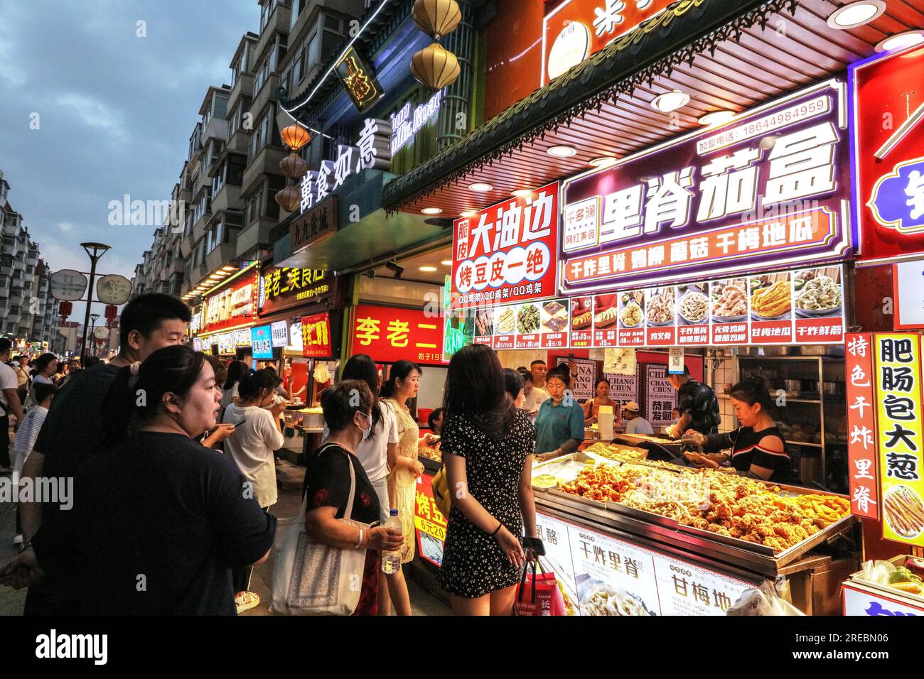 Visit the night market on a food street in Changchun City, northeast ...