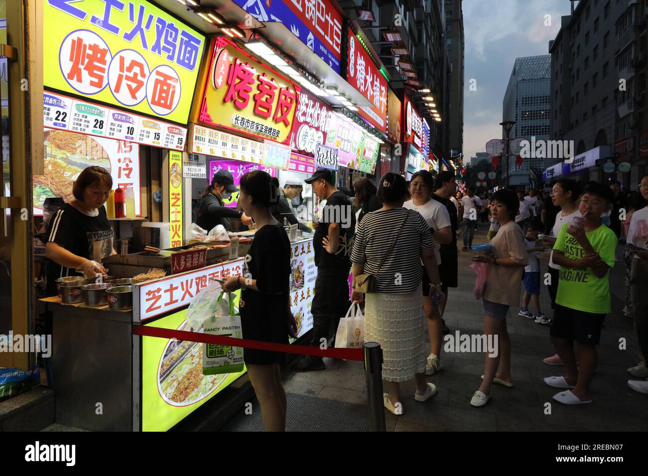 Visit the night market on a food street in Changchun City, northeast ...