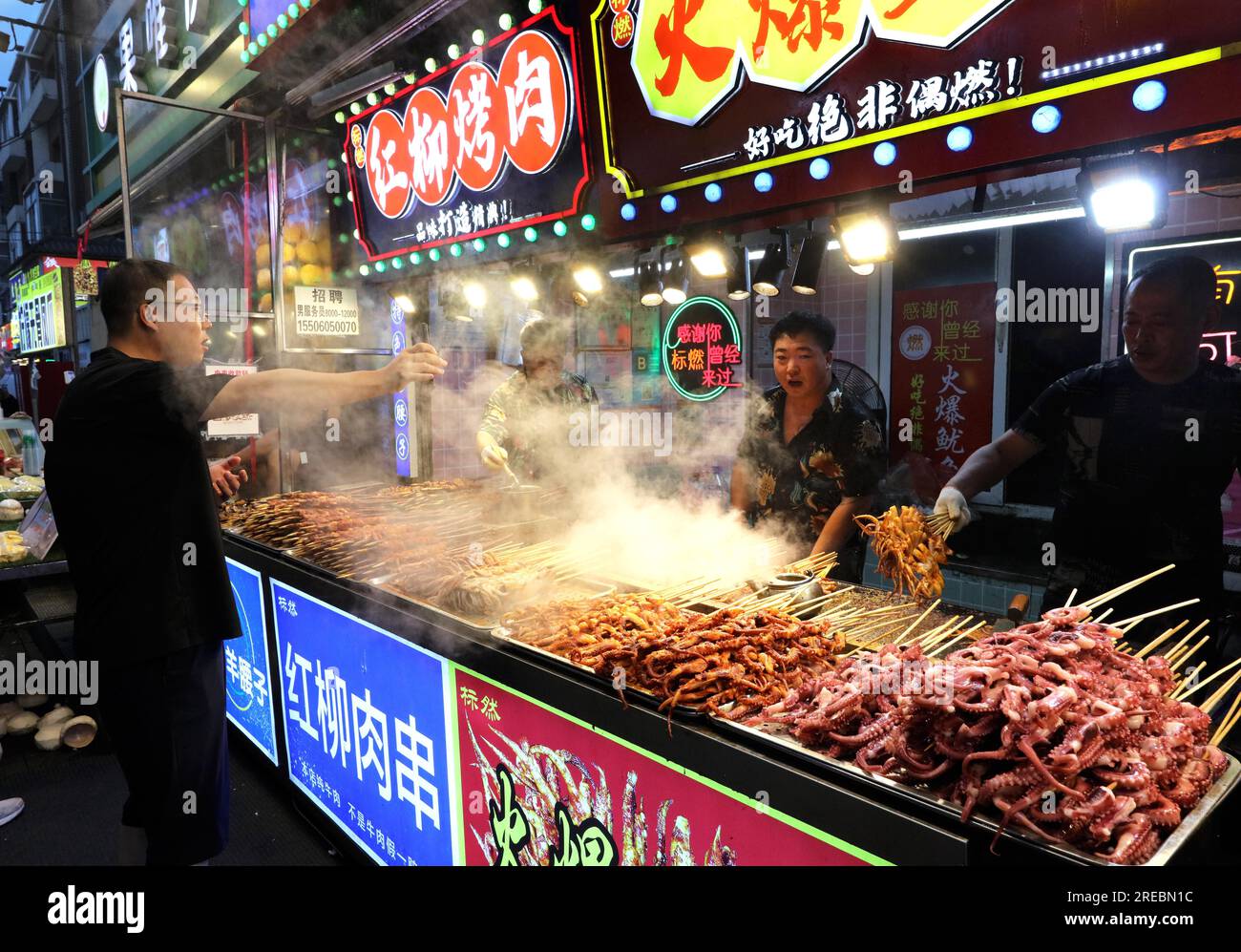 Visit the night market on a food street in Changchun City, northeast ...