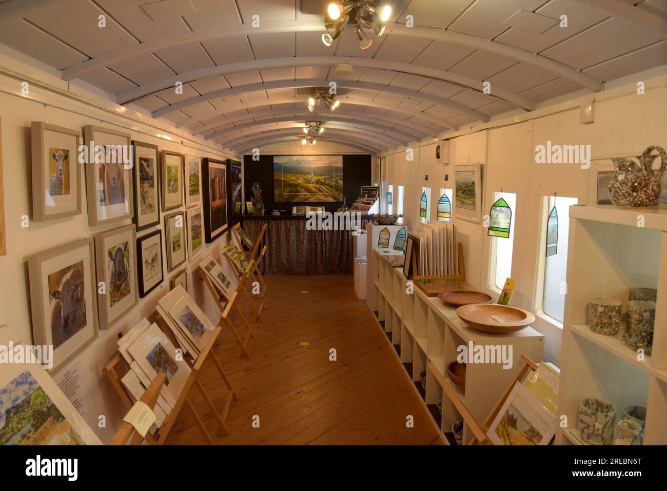 Paintings on display in a restored Great Western Railway carriage at ...