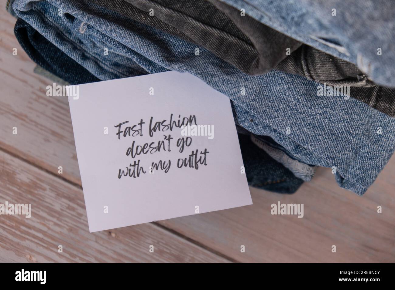 FAST FASHION DOESNT GO WITH MY OUTFIT text on paper note on Jeans ...