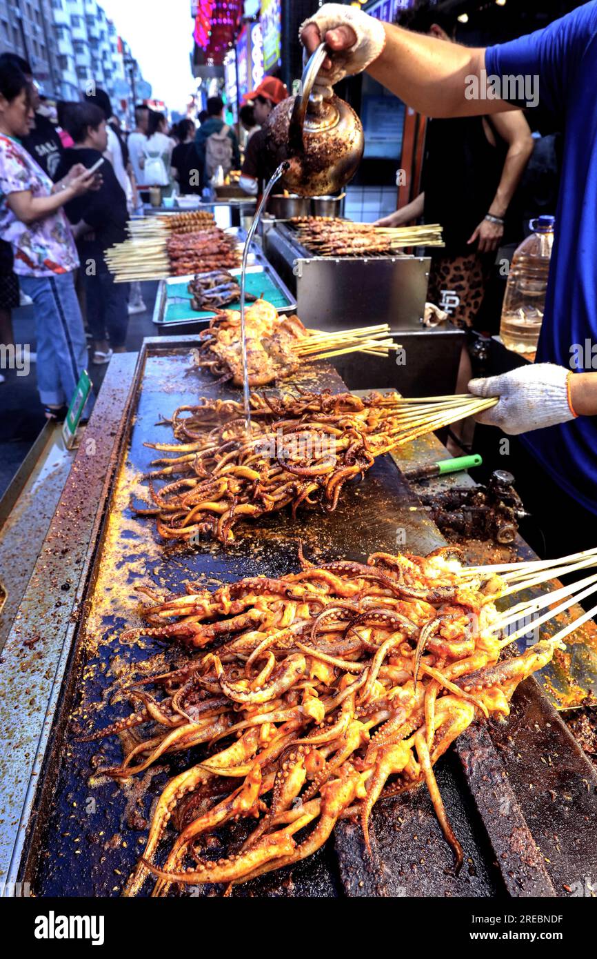Visit the night market on a food street in Changchun City, northeast ...
