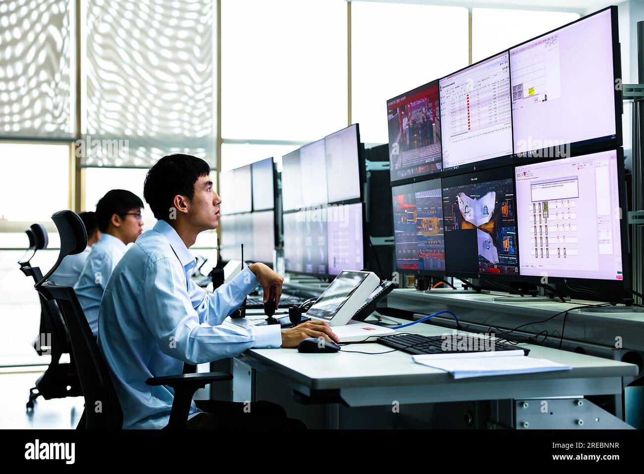 SUZHOU, CHINA - JULY 19, 2023 - Workers monitor terminal operations ...