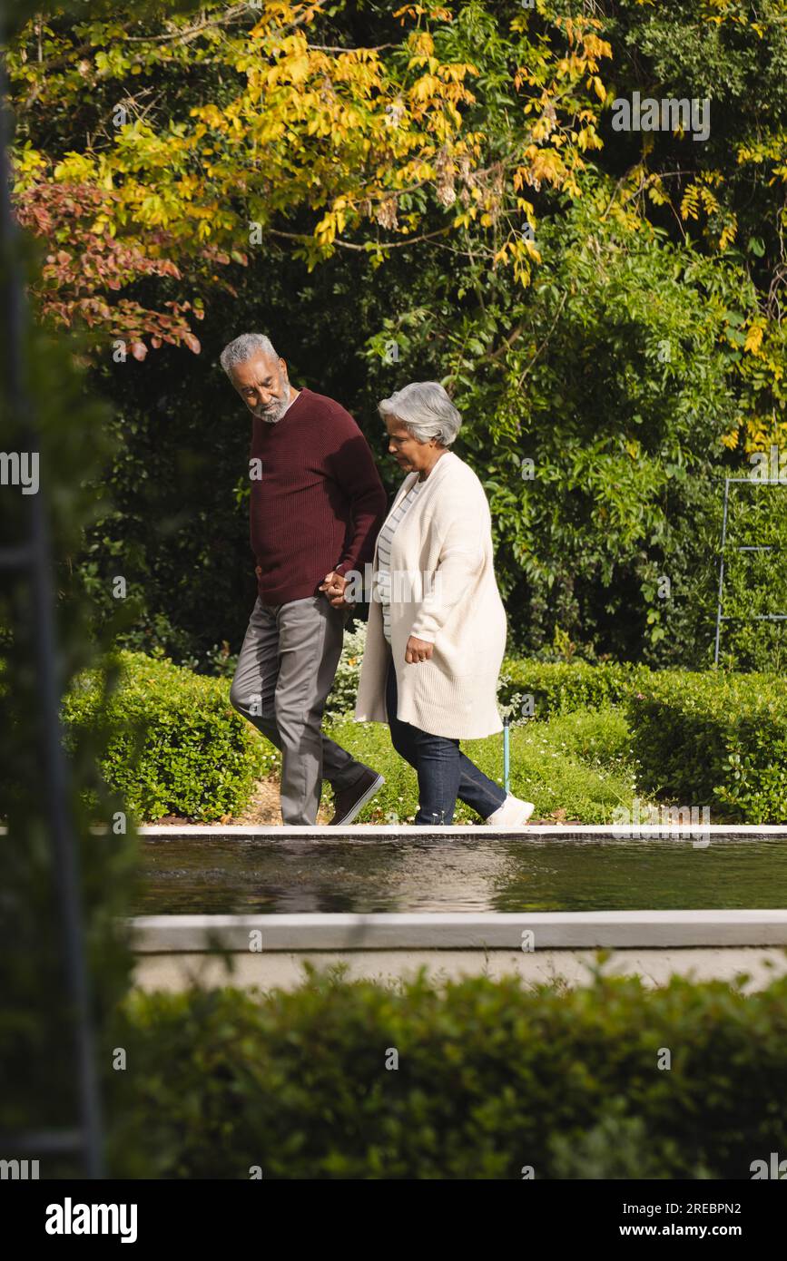 Senior biracial couple holding hands hi-res stock photography and images - Alamy