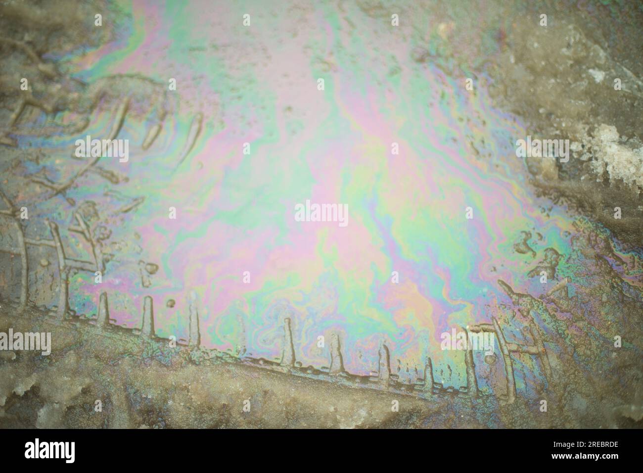 Gasoline on road. Fuel stain in puddle. Waste from transport ...