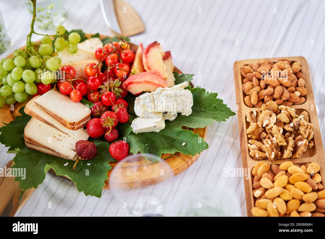 A covered buffet table for a master class. Cheeses, fruits and nuts ...