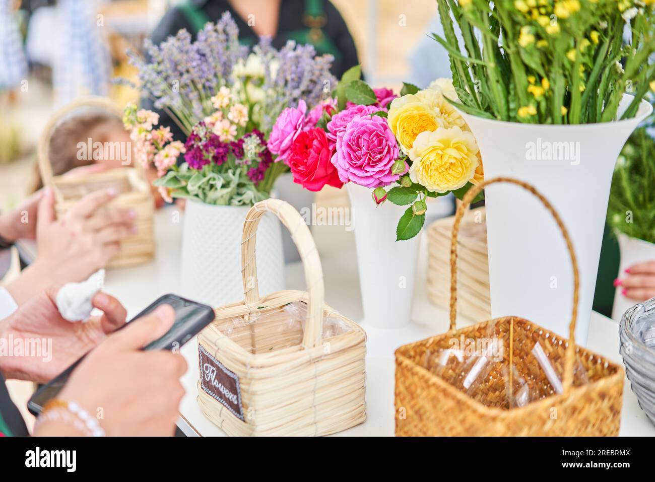 Master class on making bouquets. Spring bouquet in wicker basket ...