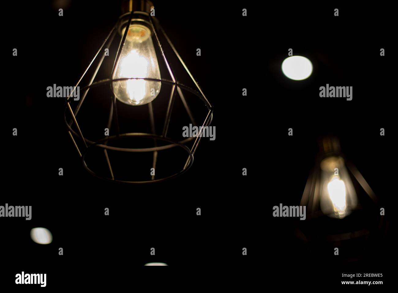 Lamp is in interior. Incandescent lamp on black background. Interior ...