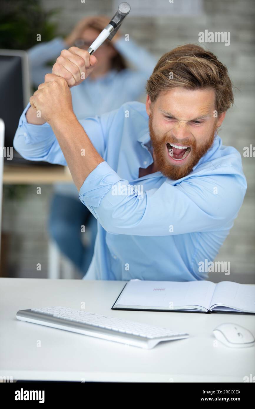 Hand businessman holding hammer hi-res stock photography and images - Alamy