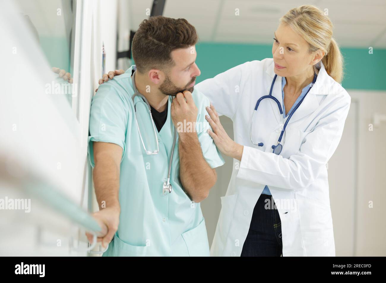 sick male nurse wearing blue uniform Stock Photo - Alamy