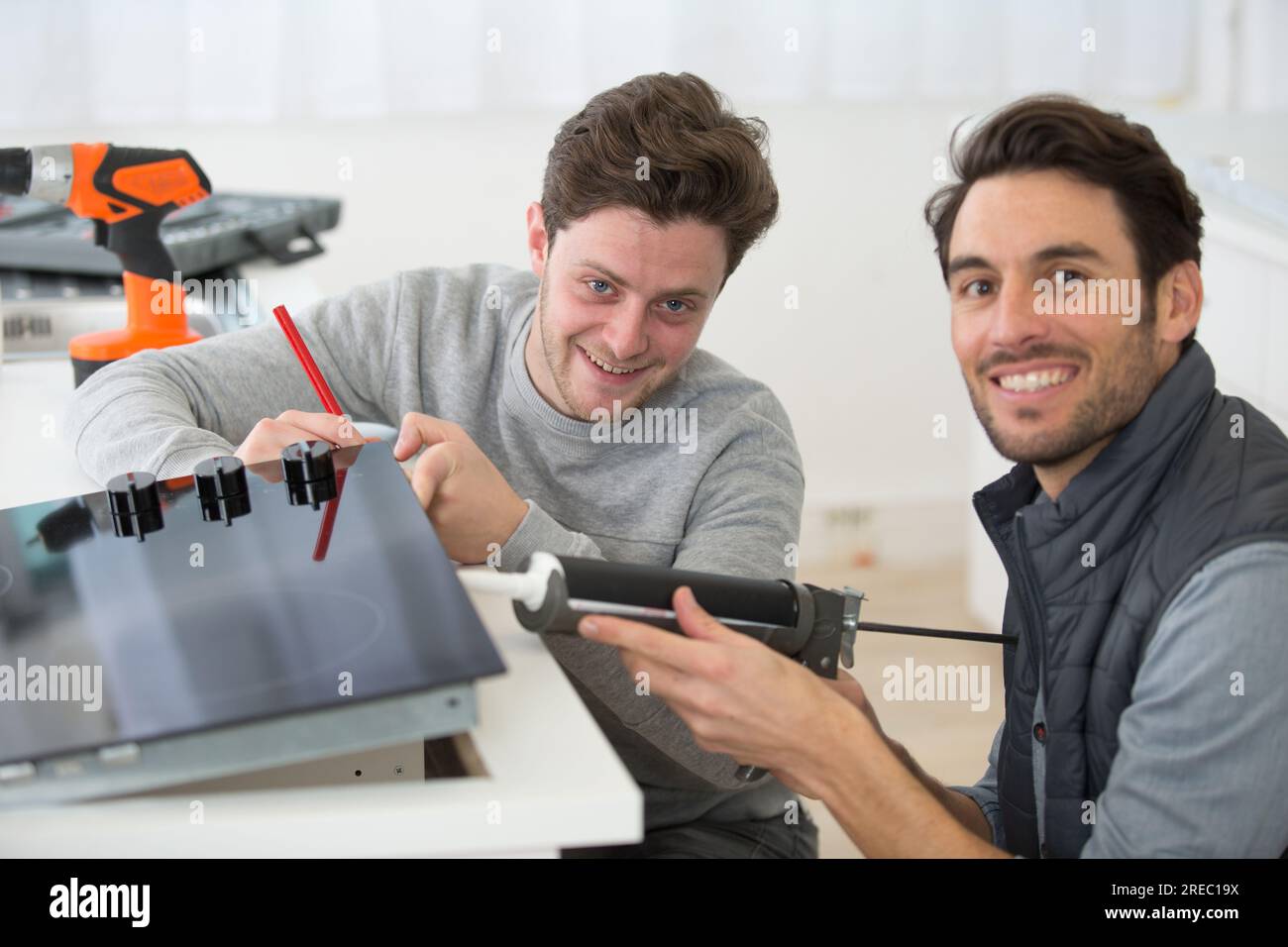 Worker hands fix sealant silicone hi-res stock photography and images ...