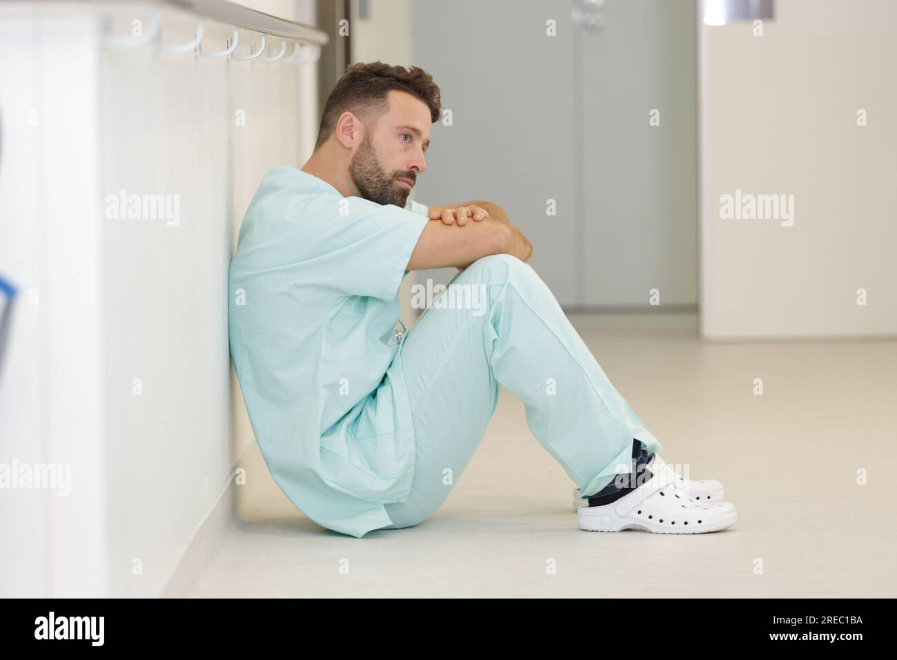 Sad surgeon sitting on floor hi-res stock photography and images - Alamy