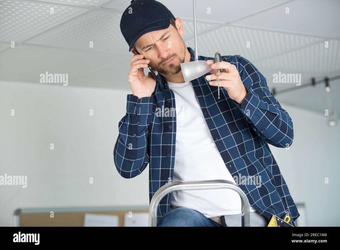 Checking light bulb hi-res stock photography and images - Alamy