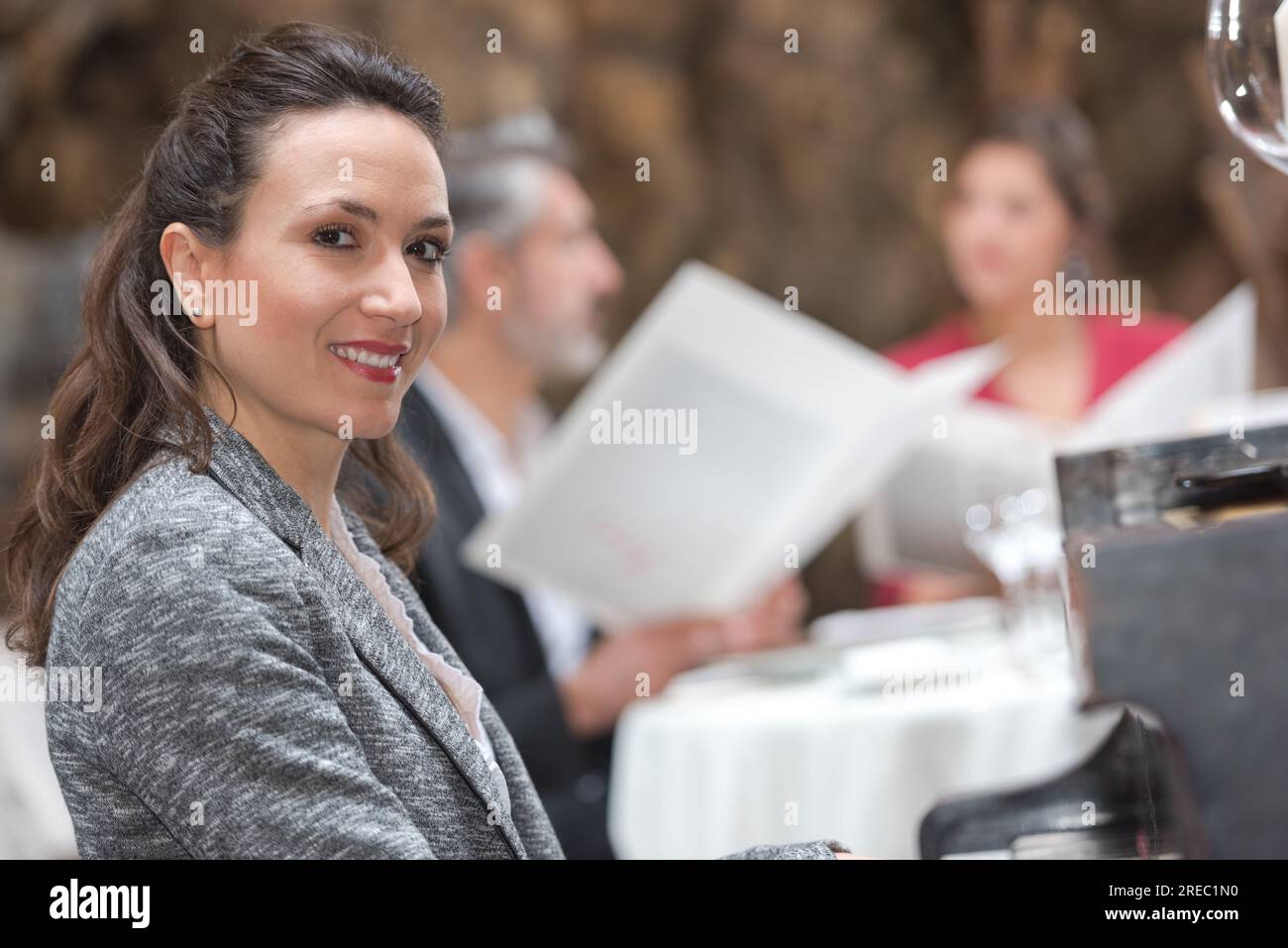 portrait of smiling waitress in restaurant Stock Photo - Alamy
