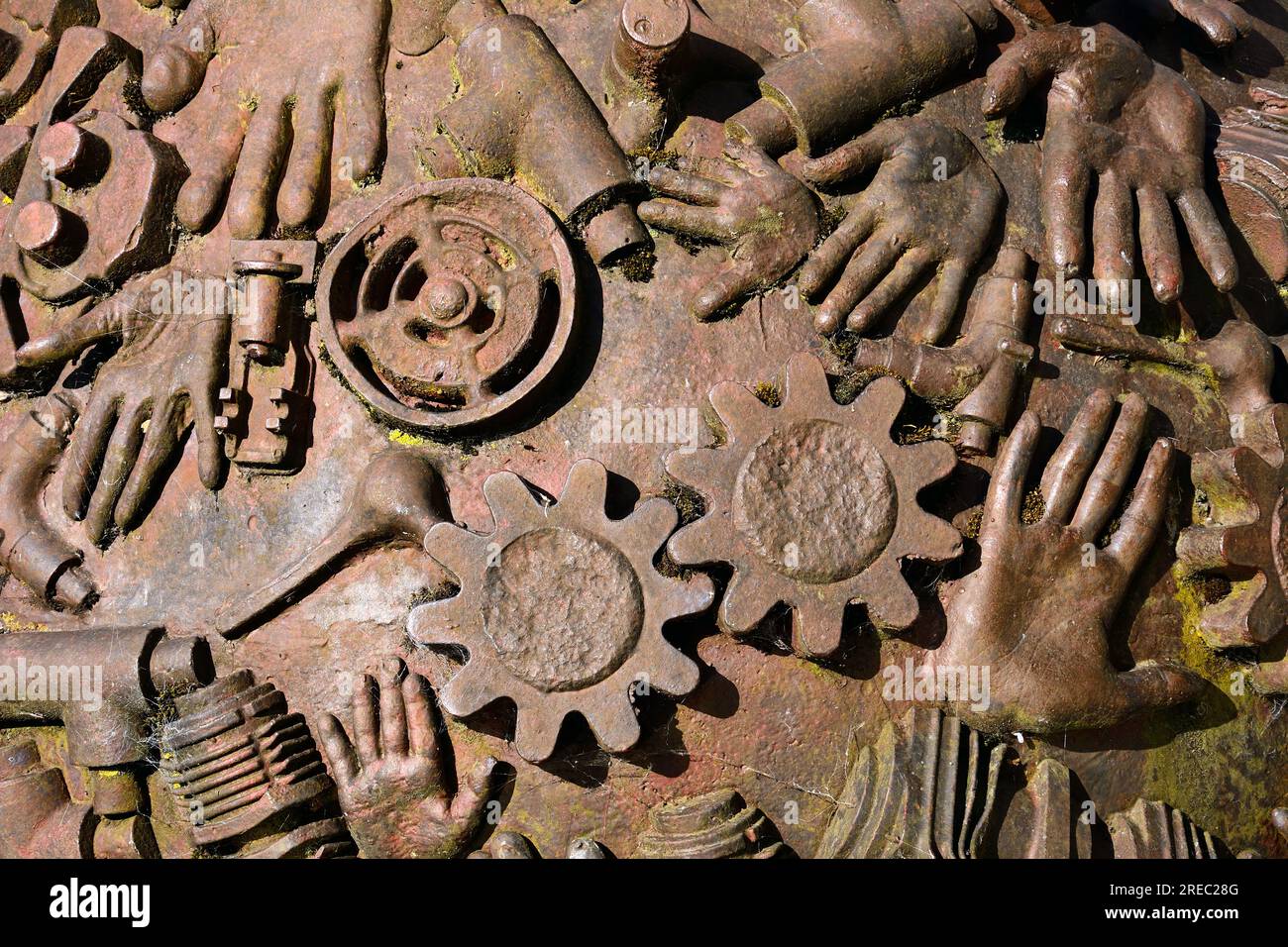 Hand casts and cogs detail on the boulder statue by Neville Cable along ...