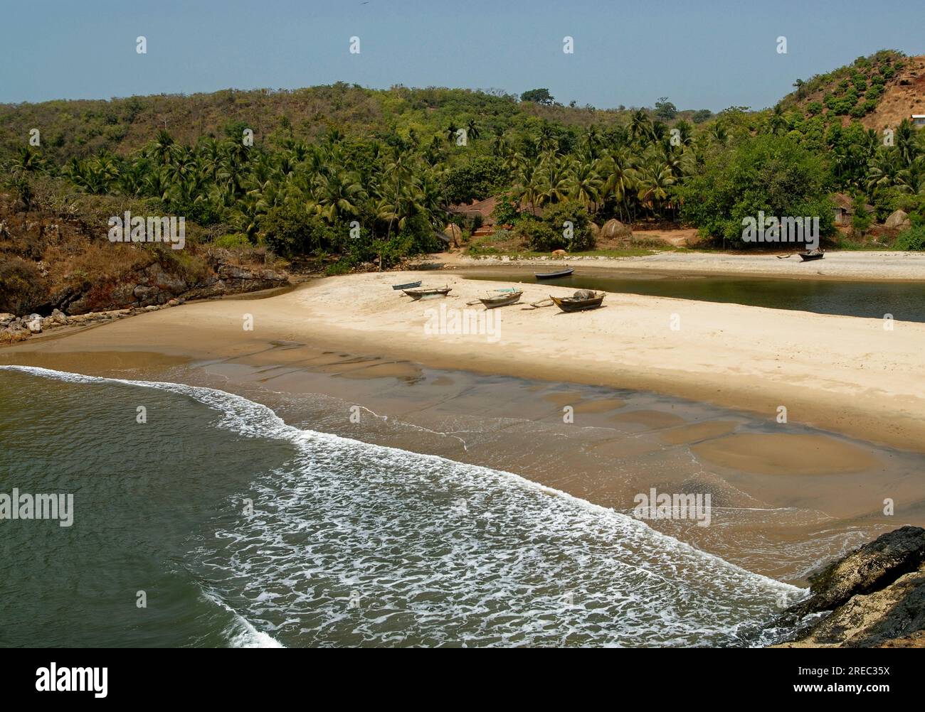 Fishing boats parked on the sandy beach of Nivati Stock Photo - Alamy