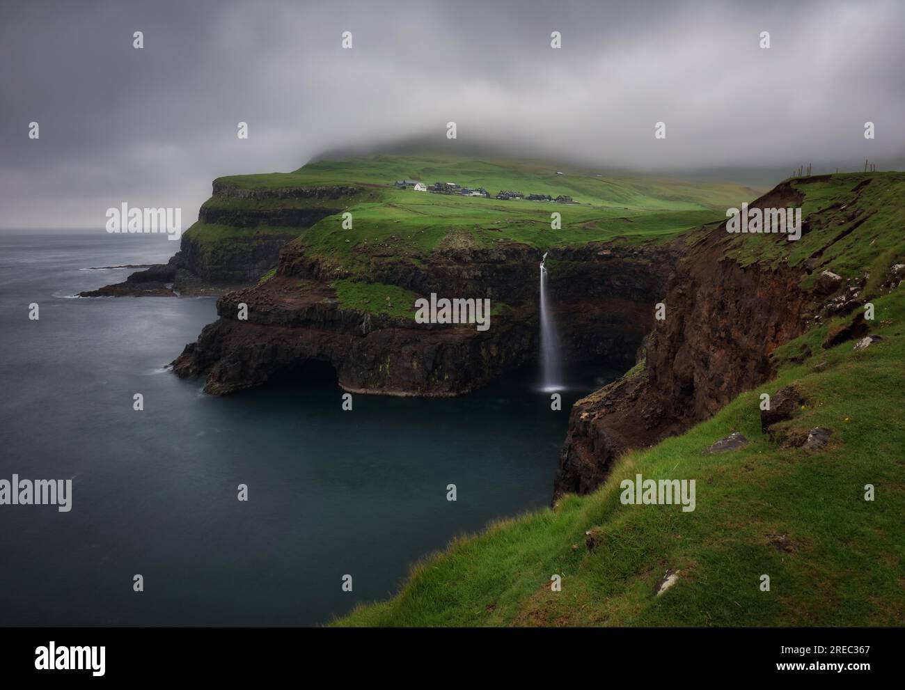 Gasadalur village and Beautiful waterfall with dark clouds, Vagar ...