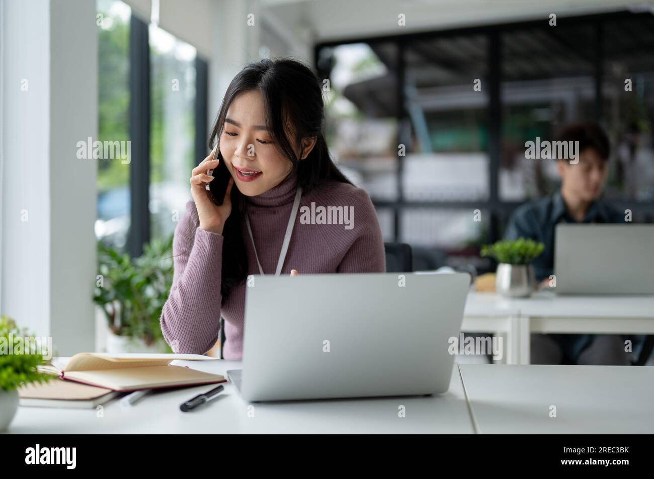 A beautiful and professional Asian businesswoman or female sales ...