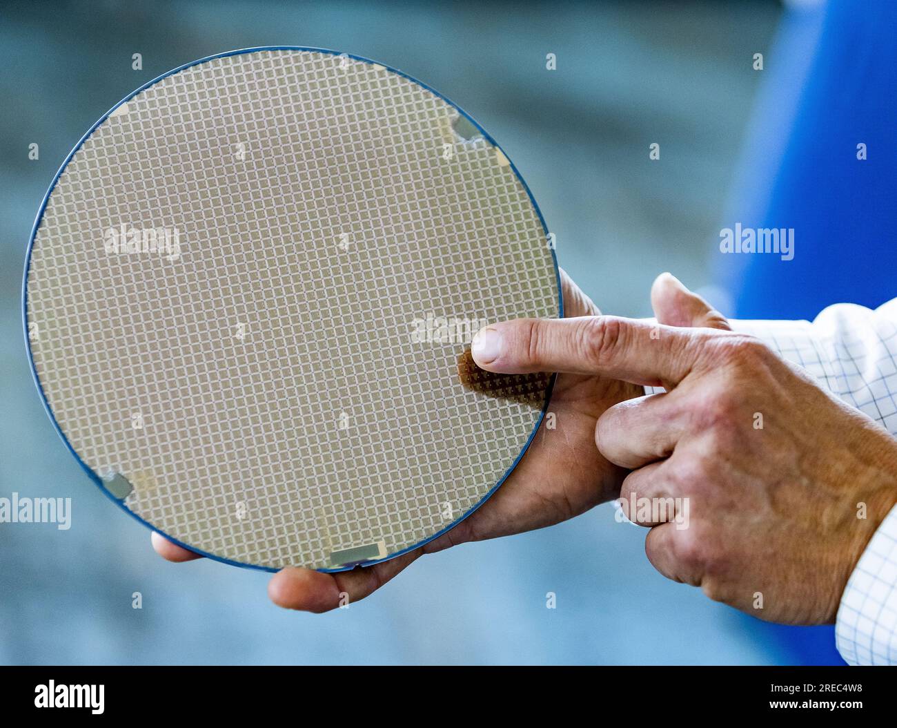 NIJMEGEN - A so-called wafer on which chips are made in the factory of ...