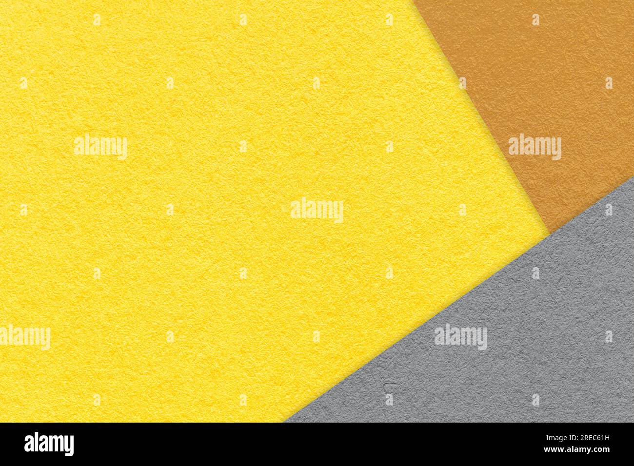 Texture of craft bright yellow color paper background with dark orange ...