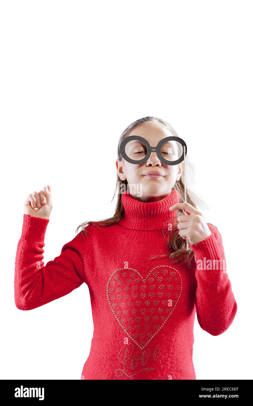 girl goofing around with cardboard disguises, making amusing faces to ...