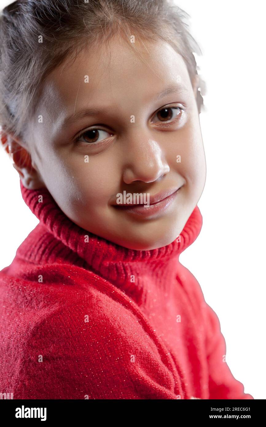 In a side view, a close-up shot captures a girl with a sweet yet ...