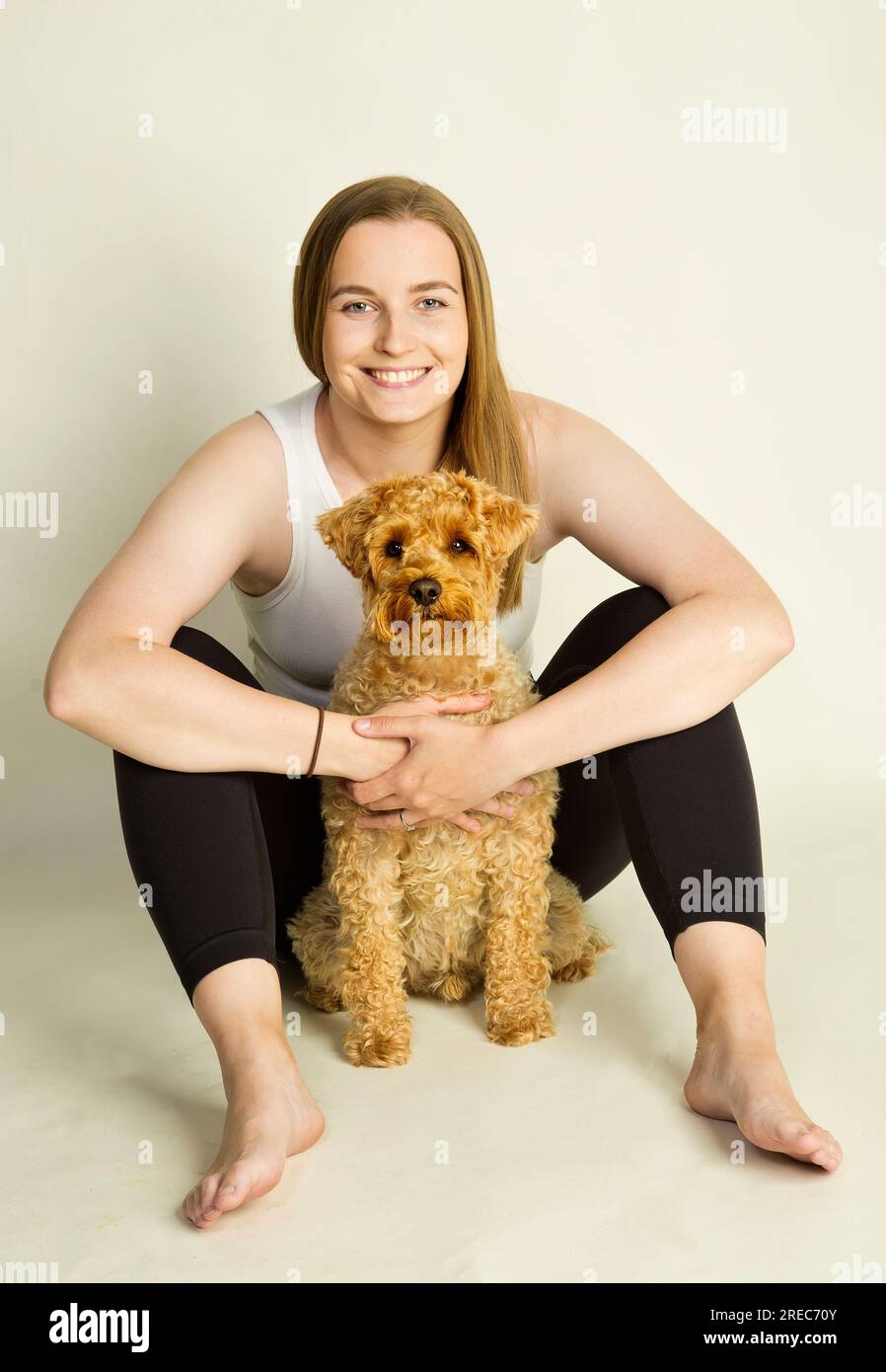 A girl with her pet schnoodle Stock Photo - Alamy