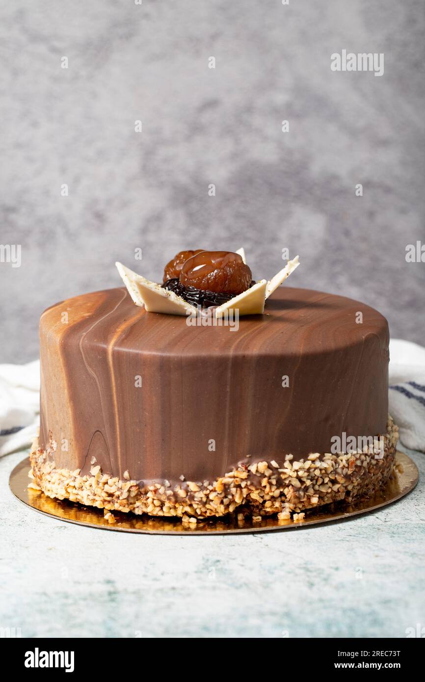 Chocolate cake. Chocolate, chestnut and pistachio birthday cake on gray ...