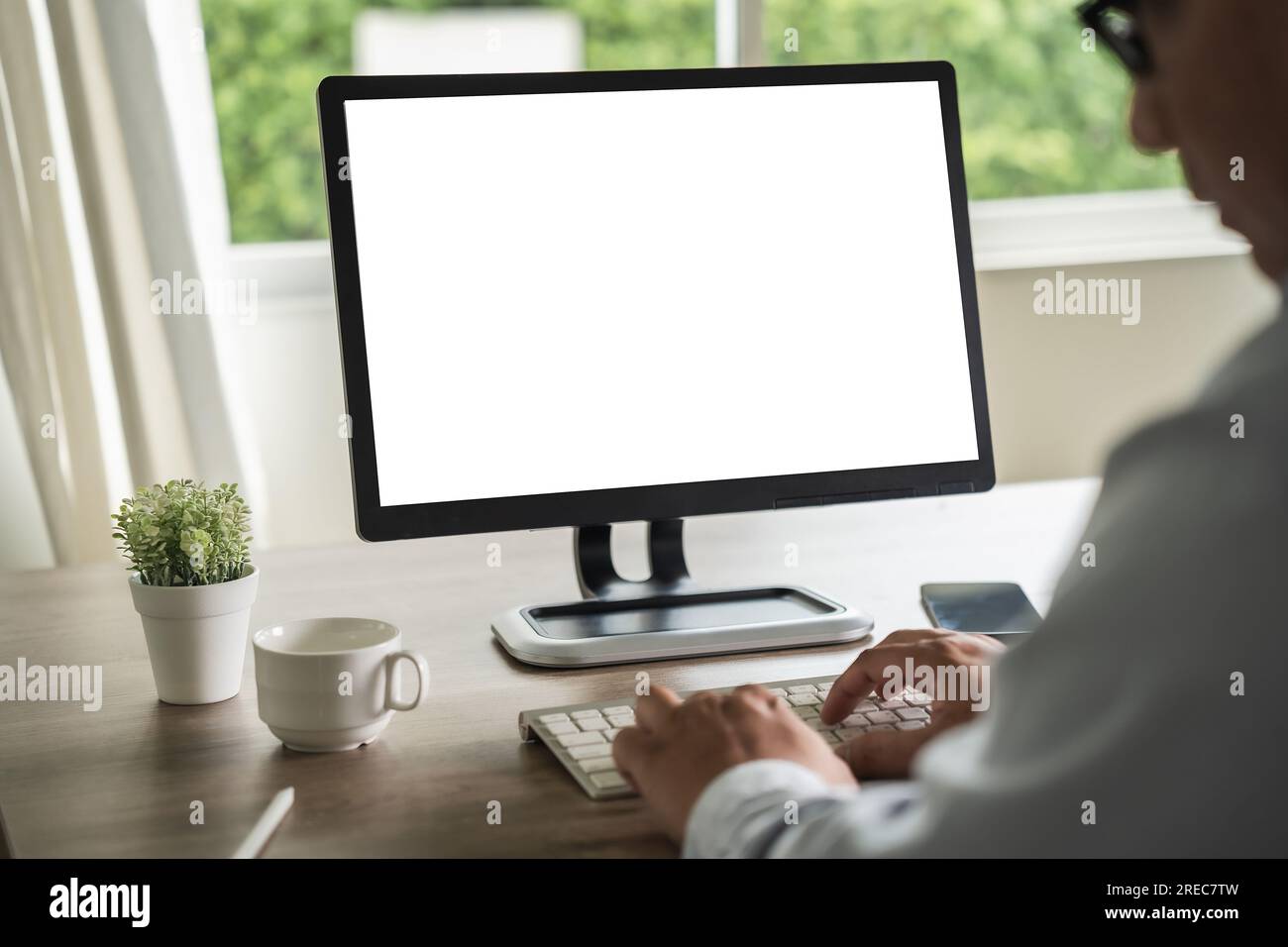 man working Businessman using a desktop computer of the blank screen ...