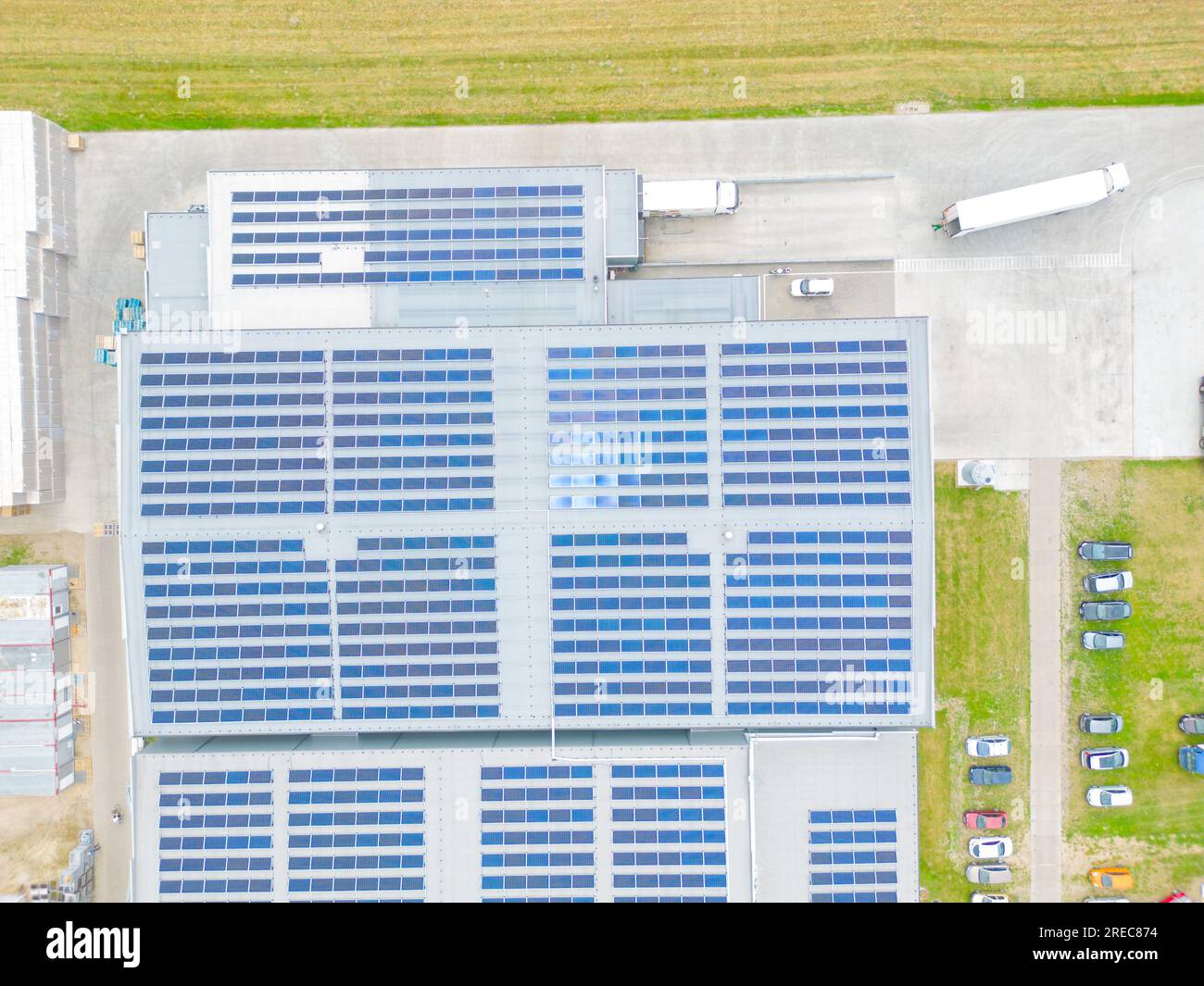 Aerial view of modern storage warehouse with solar panels on the roof ...