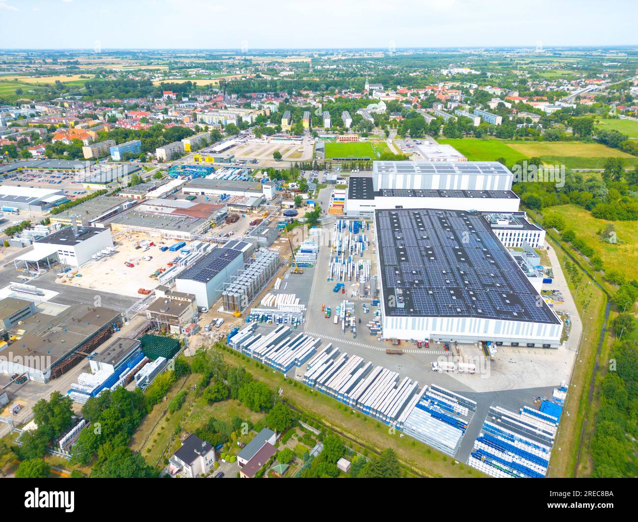 Aerial view of modern storage warehouse with solar panels on the roof ...