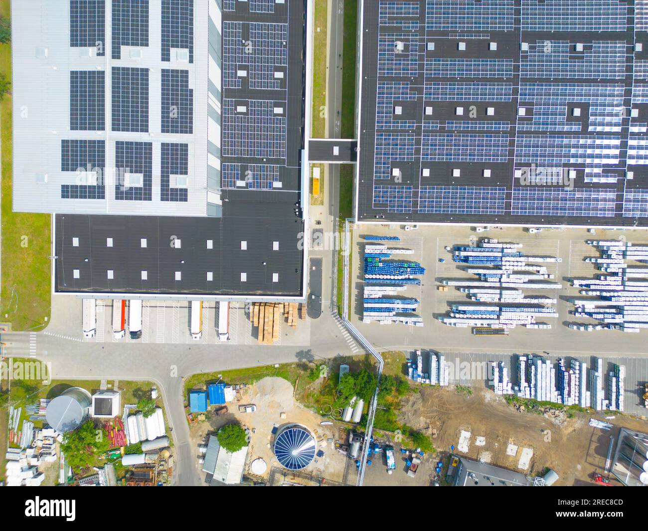 Aerial view of modern storage warehouse with solar panels on the roof ...