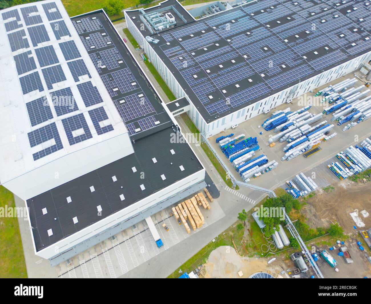 Industry with low carbon footprint. Industrial warehouses with solar ...