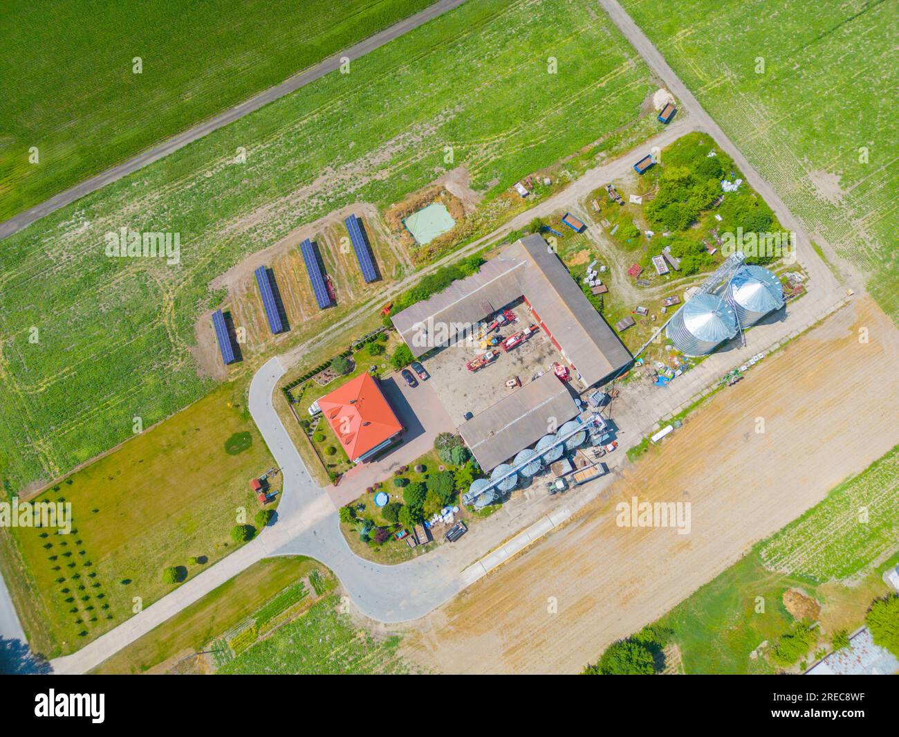 Aerial view of farm, red barns, corn field in September. Harvest season ...
