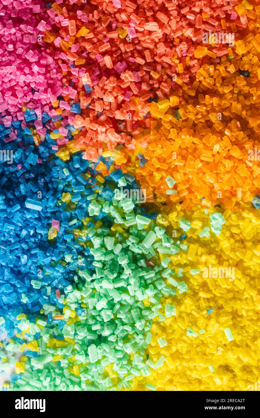 Close up of multi coloured sand grains background Stock Photo - Alamy