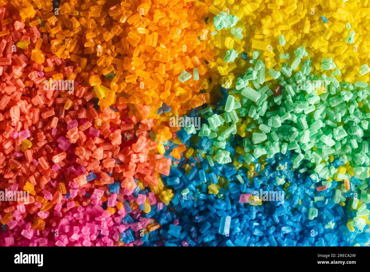 Close up of multi coloured sand grains background Stock Photo - Alamy